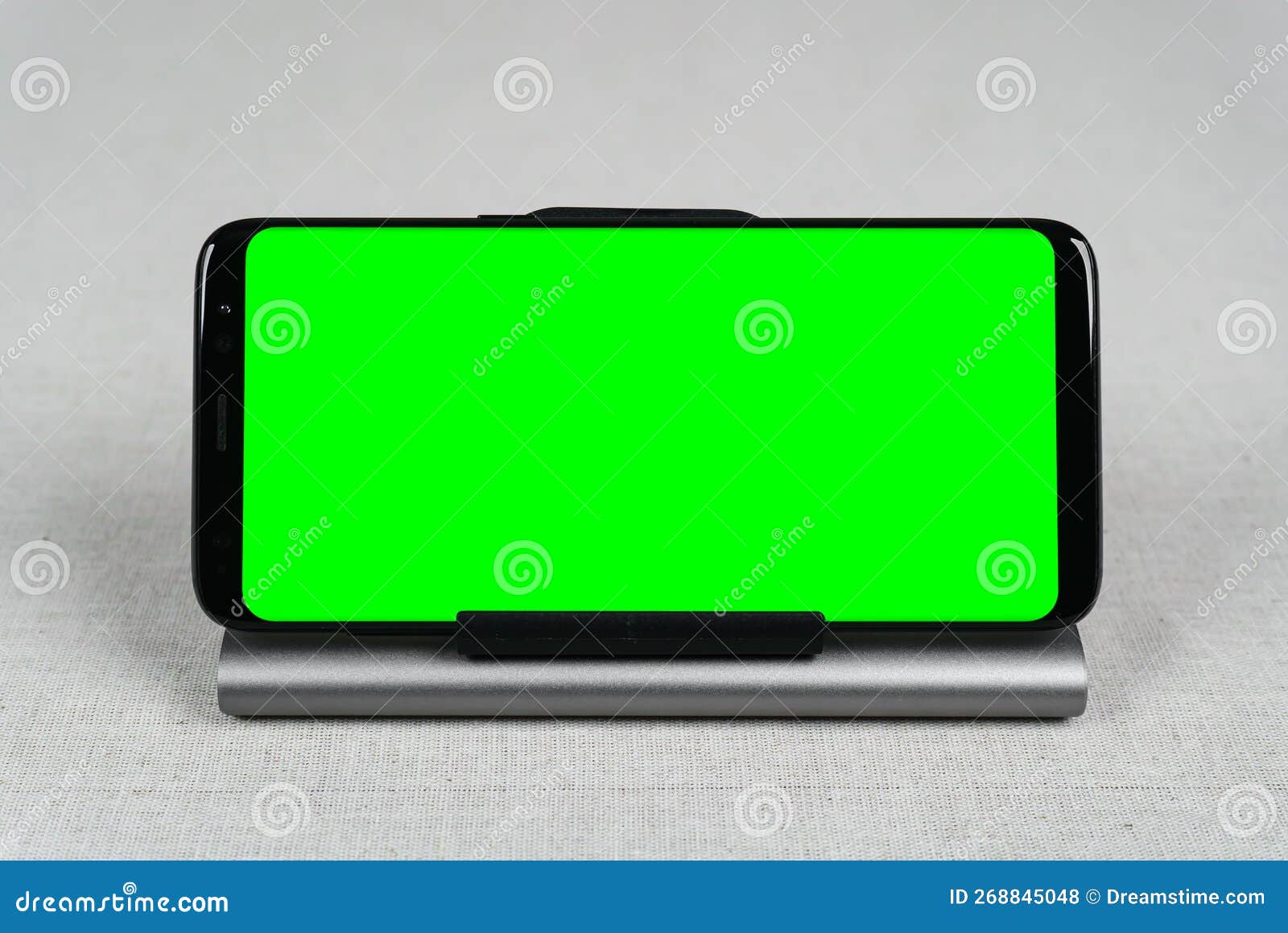 A Mobile Phone with a Green Screen Stands Horizontally Stock Photo ...