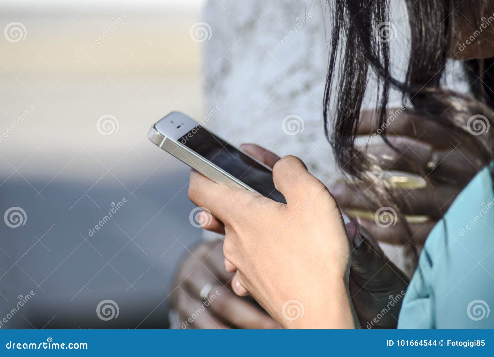 The mobile phone in hands stock photo. Image of hold - 101664544