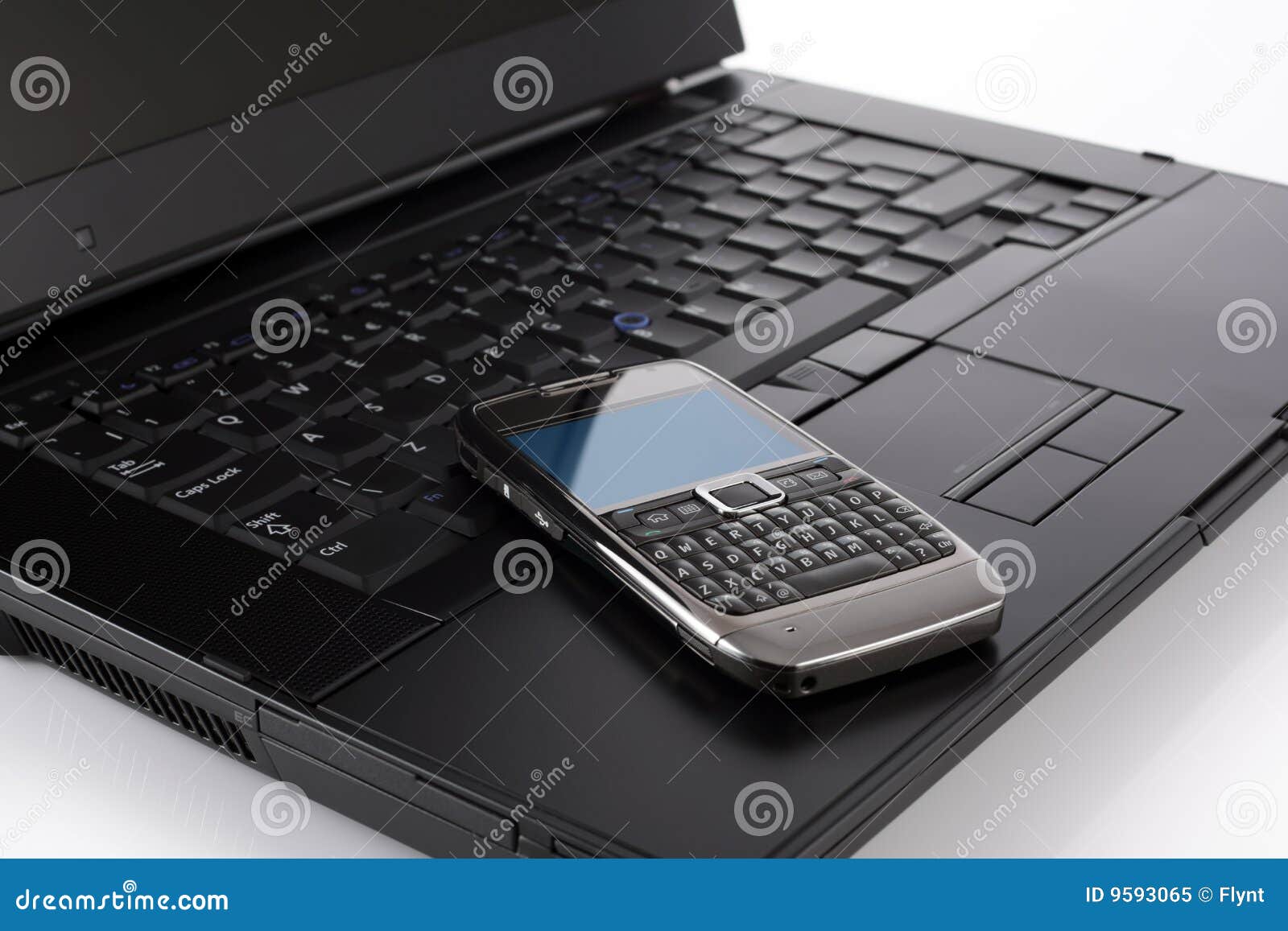 Mobile Phone on Laptop Computer Stock Image - Image of liquid ...