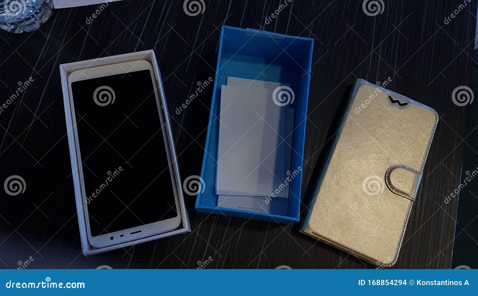 Mobile phone new unpacking stock photo. Image of christmas - 168854294