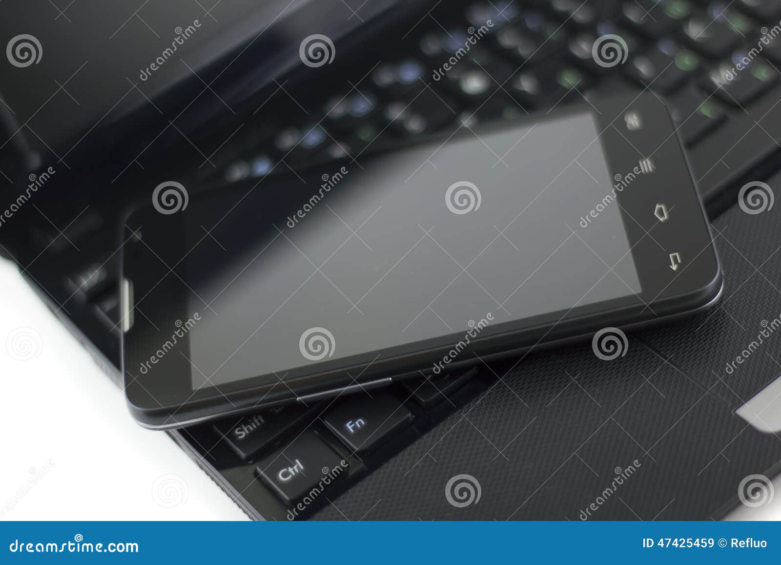 Mobile phone on notebook stock image. Image of technology - 47425459