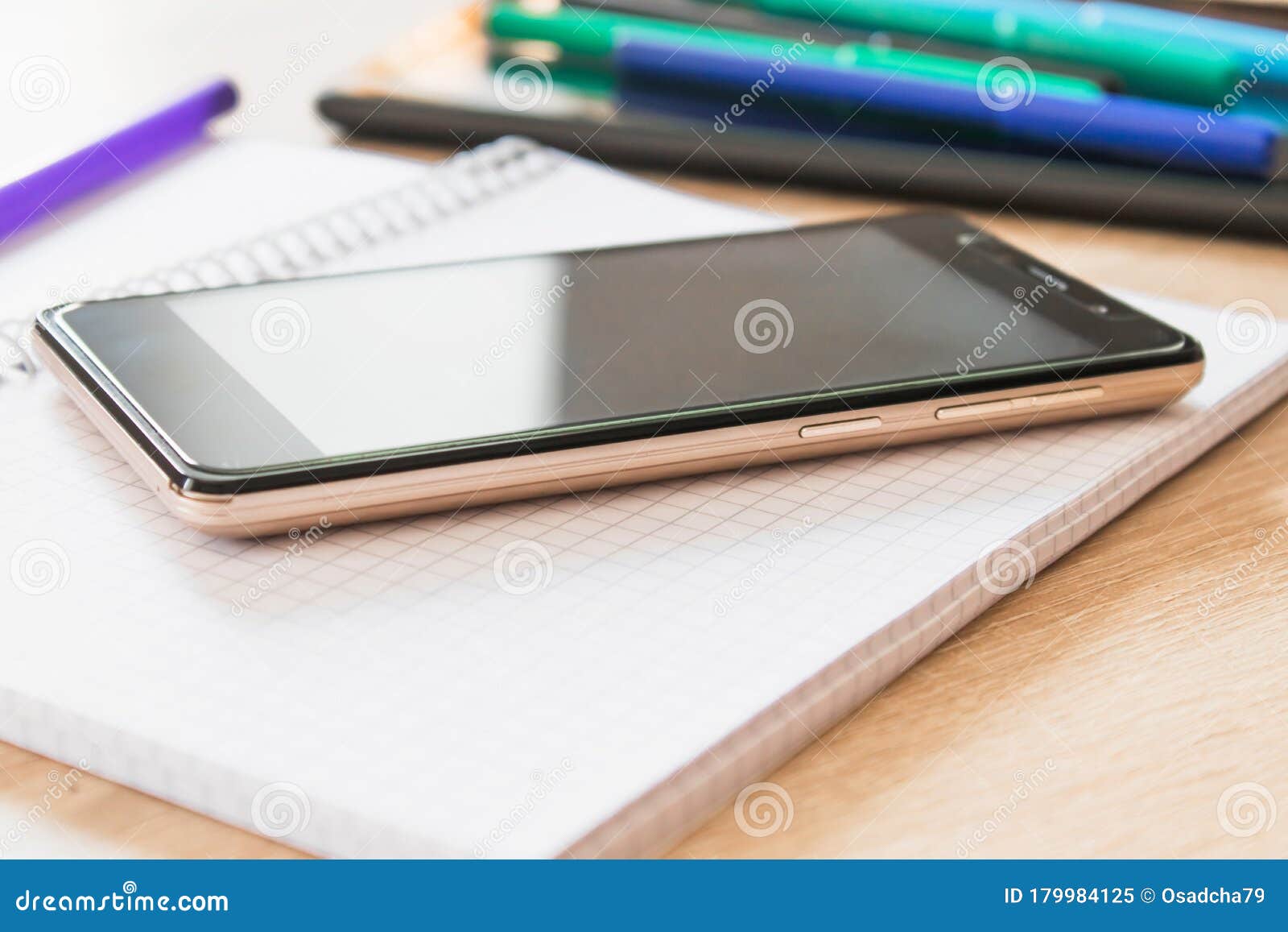 A Mobile Phone and a Notebook are on the Table Stock Image - Image of ...
