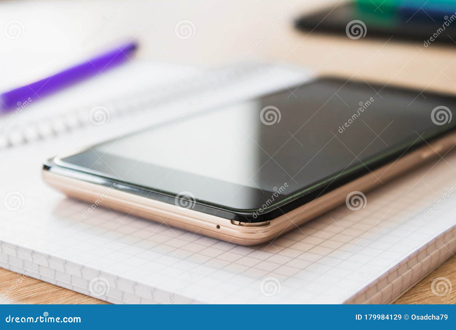 A Mobile Phone and a Notebook are on the Table Stock Image - Image of ...