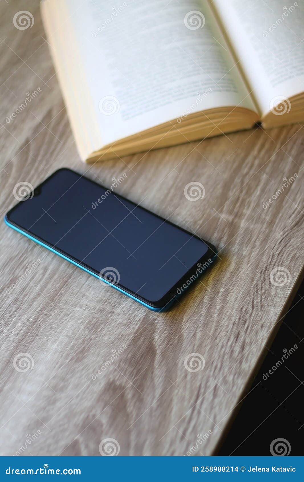 Mobile Phone and Open Book stock photo. Image of blank - 258988214