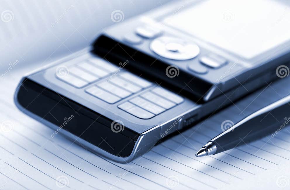 Mobile phone and pen stock photo. Image of open, office - 14797042