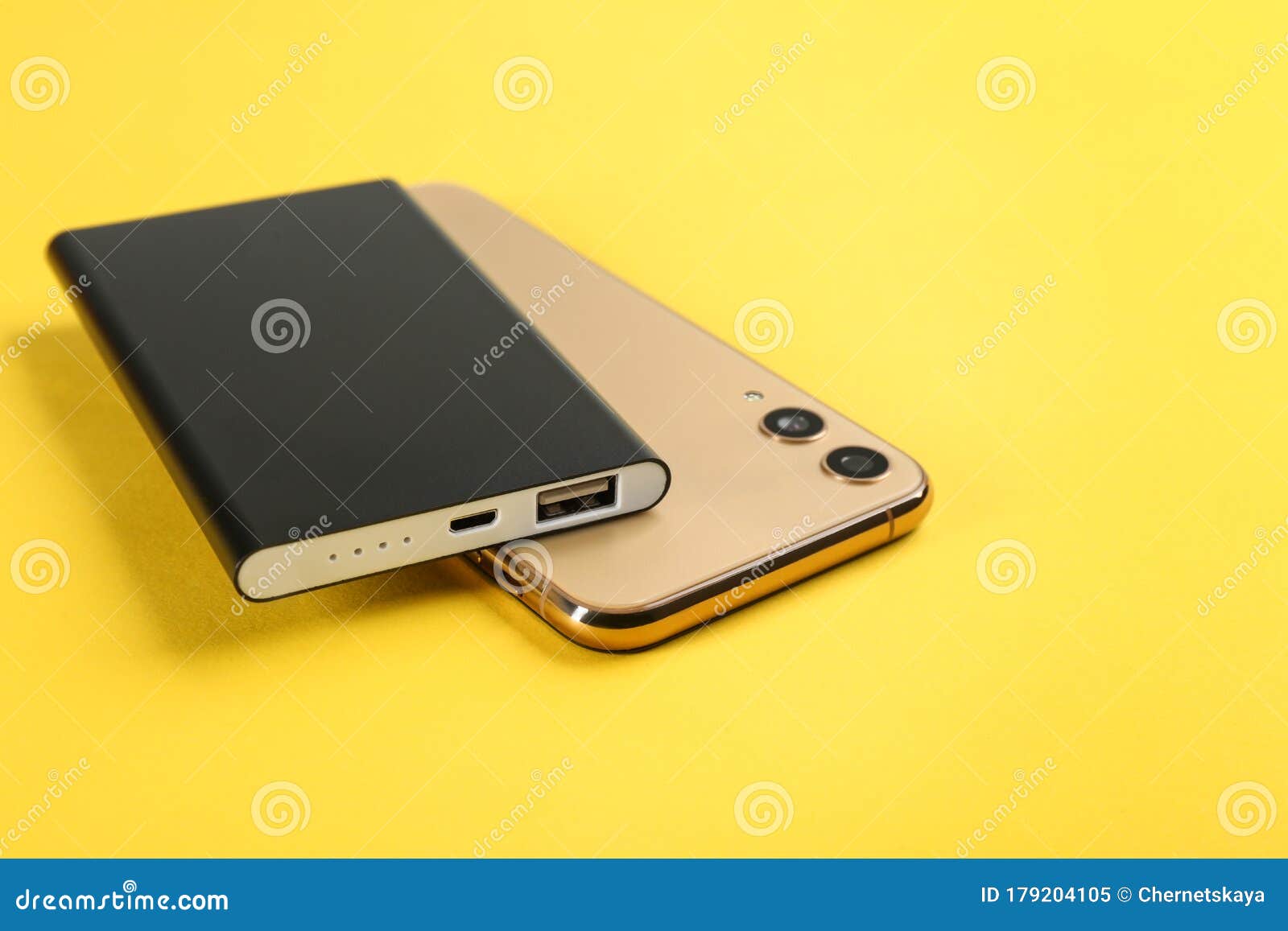 Mobile Phone and Portable Charger on Background Stock Image - Image of ...