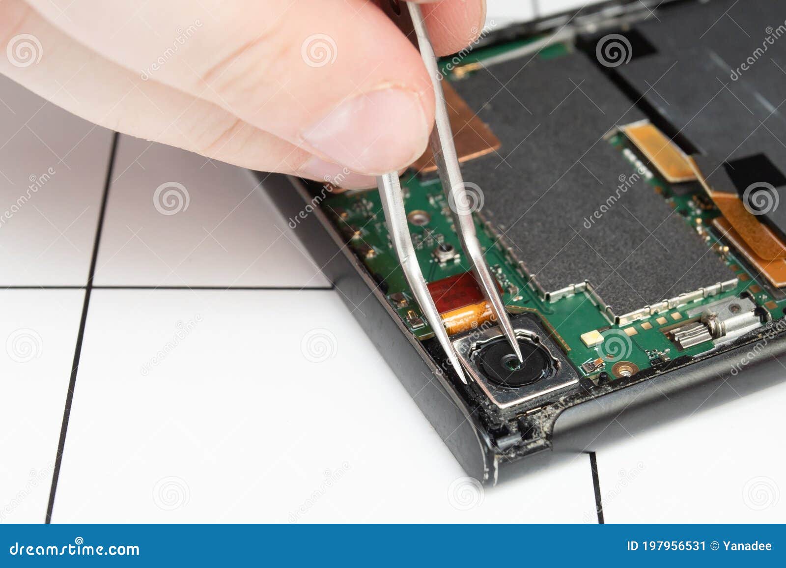 Mobile Phone Repair. the Master Pulls Out the Smartphoneâ€™s Camera ...