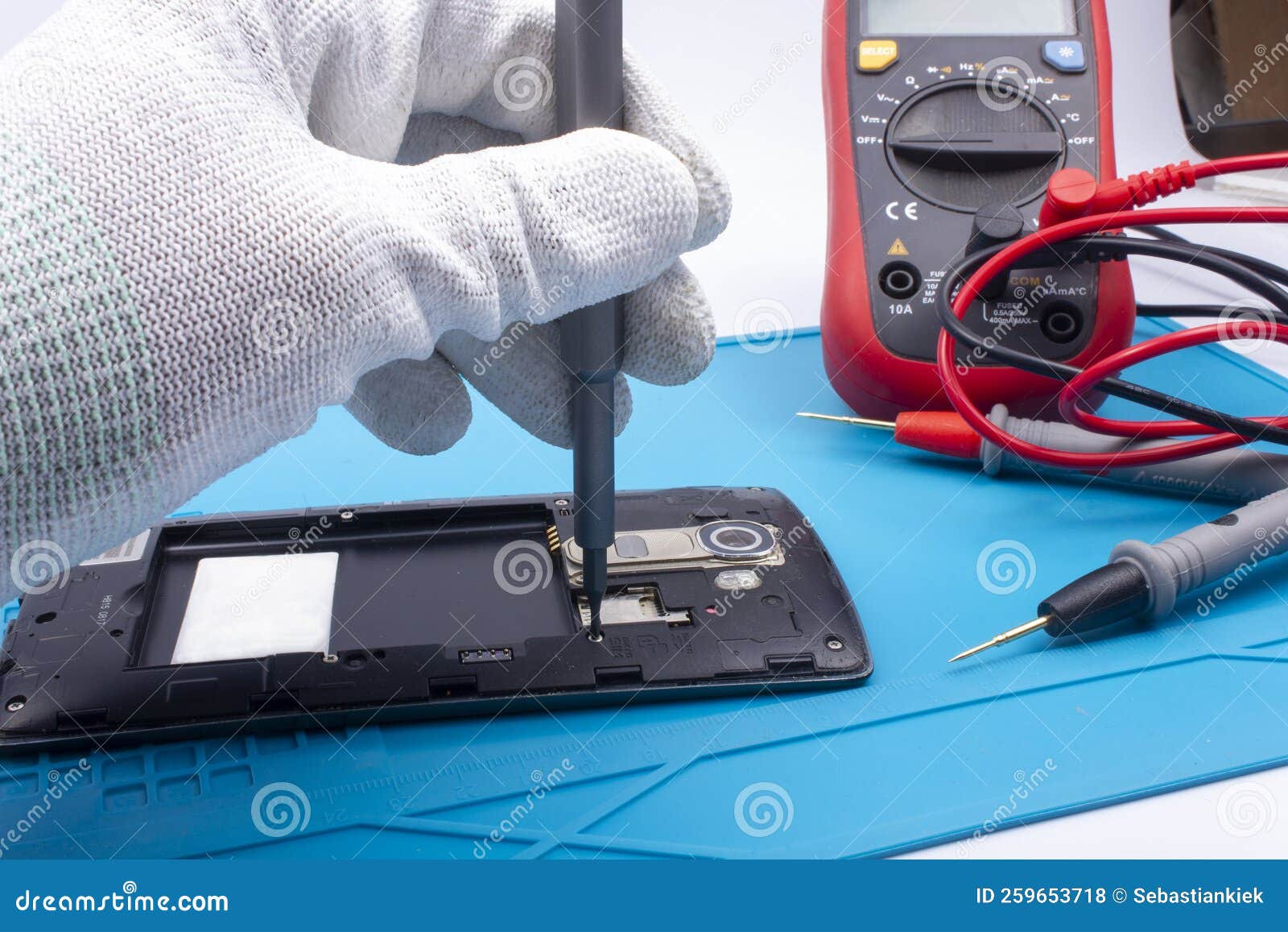 Mobile Phone Repair. the Service Technician Disassembles the Phone on ...