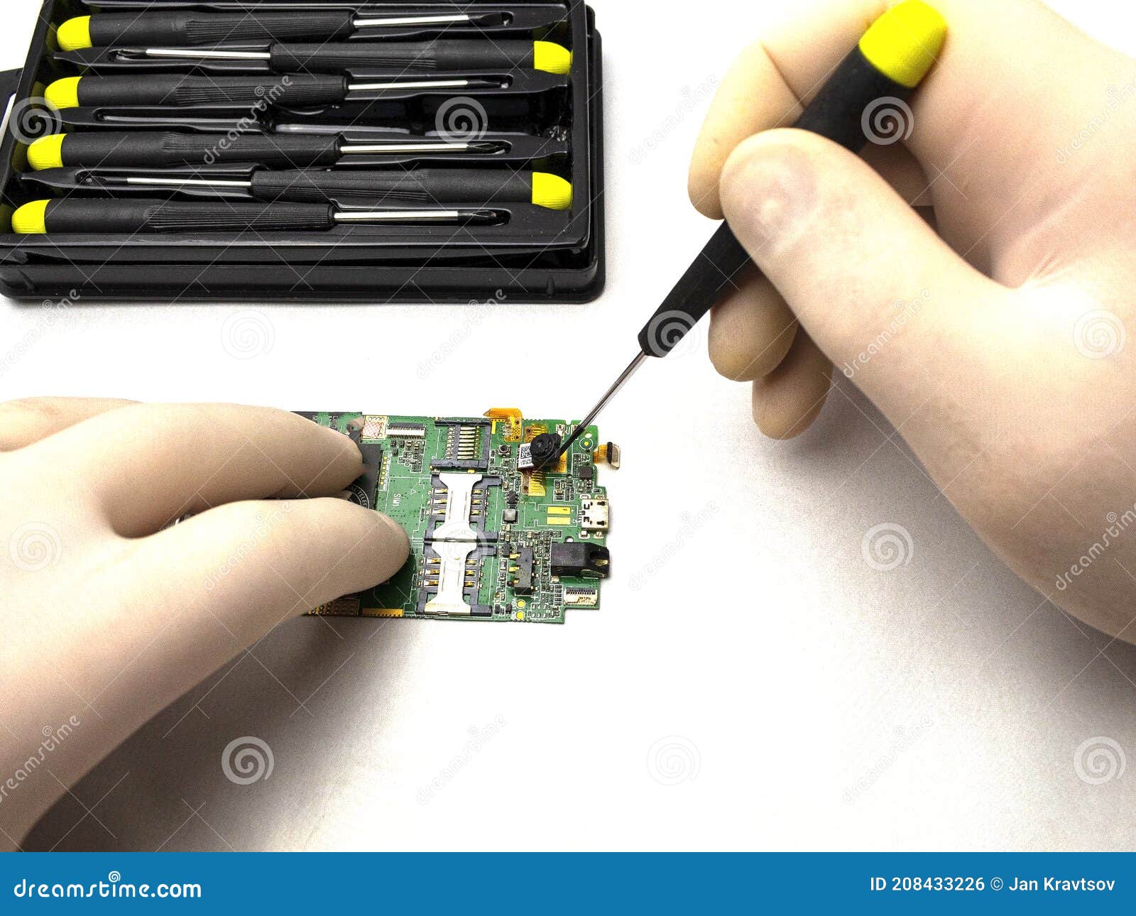 Mobile Phone Repair with Tester and Screwdriver Stock Photo - Image of ...