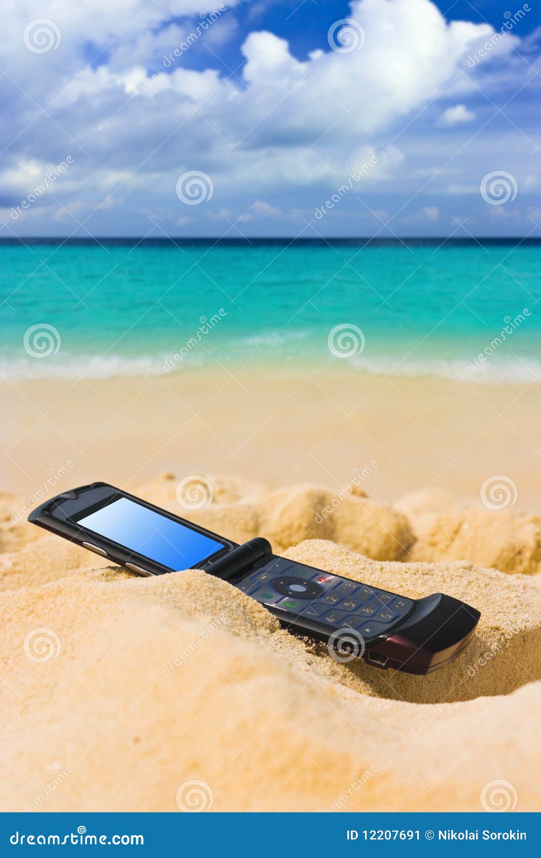Mobile phone on sand beach stock image. Image of cell - 12207691
