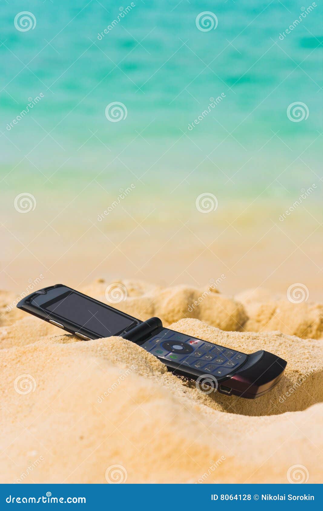 Mobile phone on sand beach stock photo. Image of freedom - 8064128