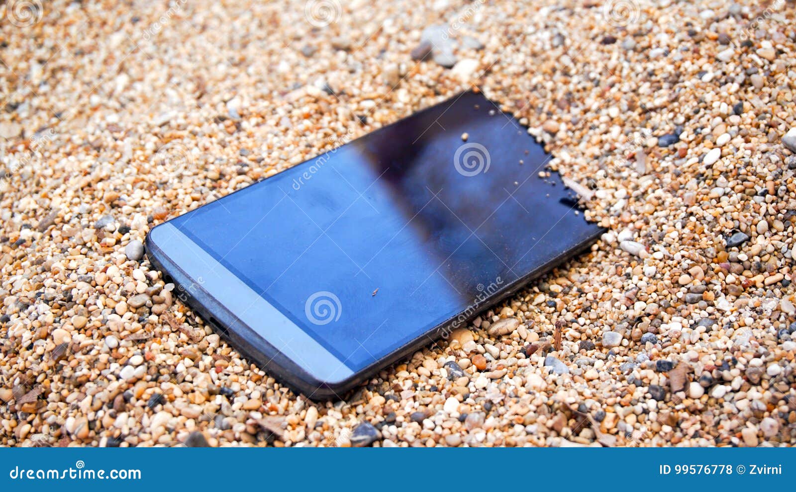 A mobile phone in the sand stock photo. Image of cellphone - 99576778
