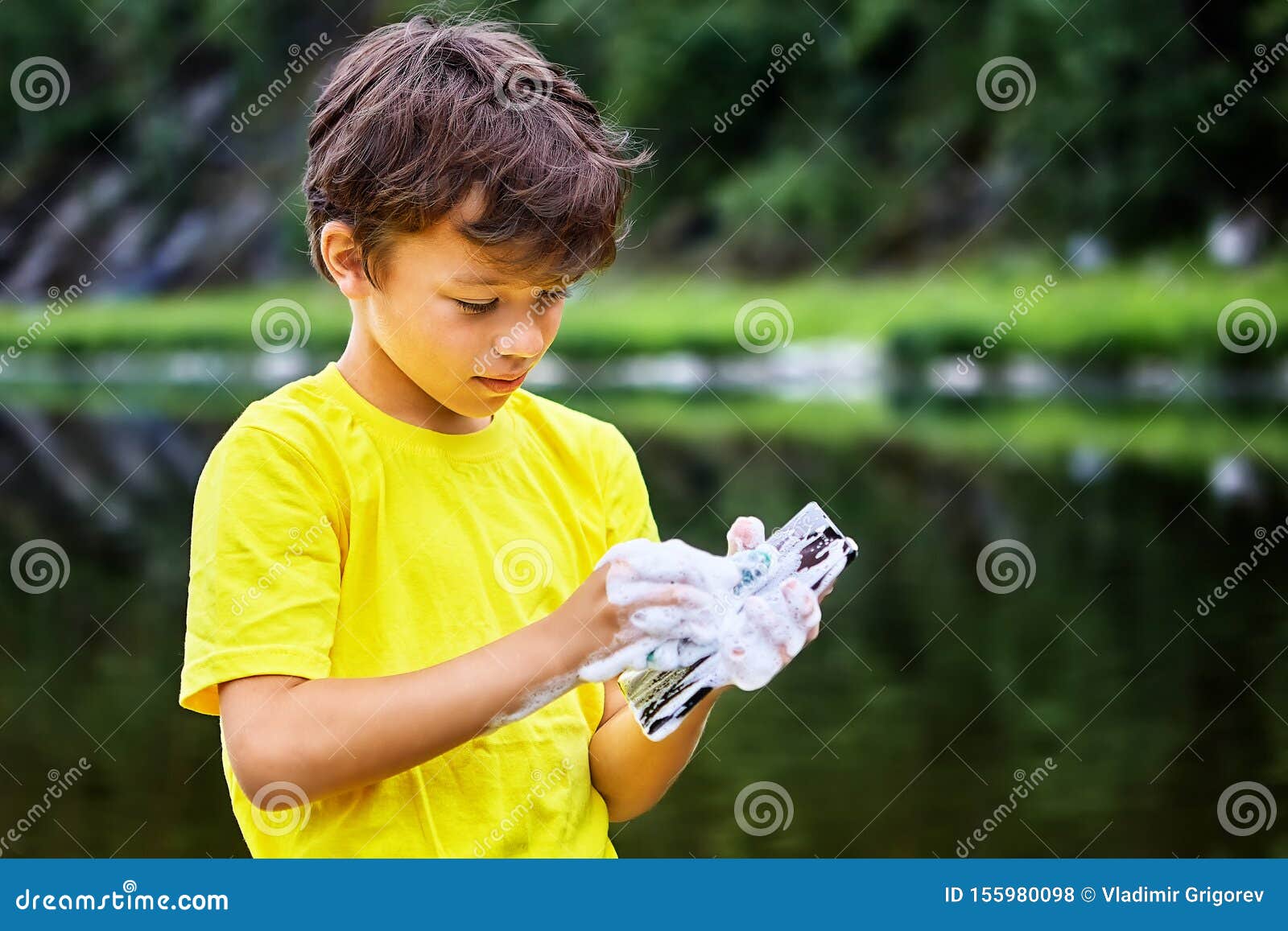 Mobile Phone Screen Care, Boy Washes a Smartphone Stock Photo - Image ...