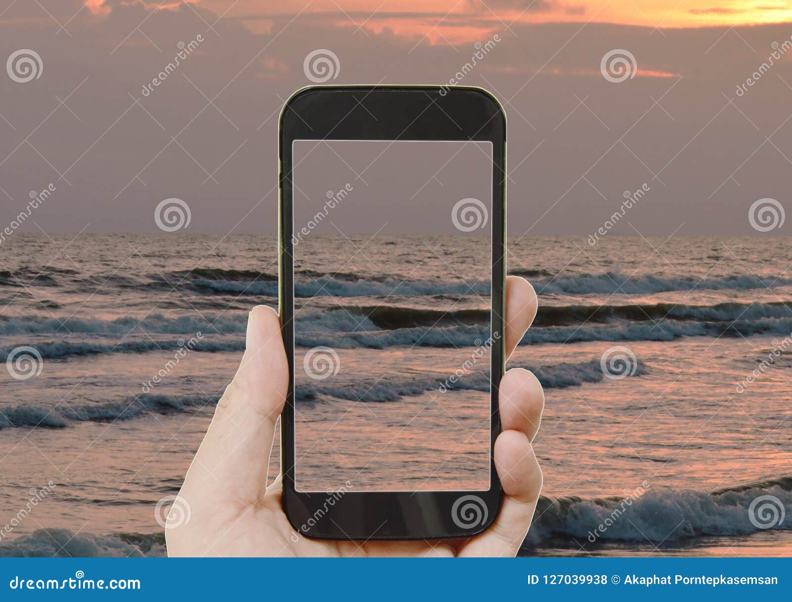 Mobile Phone Showing Landscape of Sunset on Sea Background Stock Photo ...