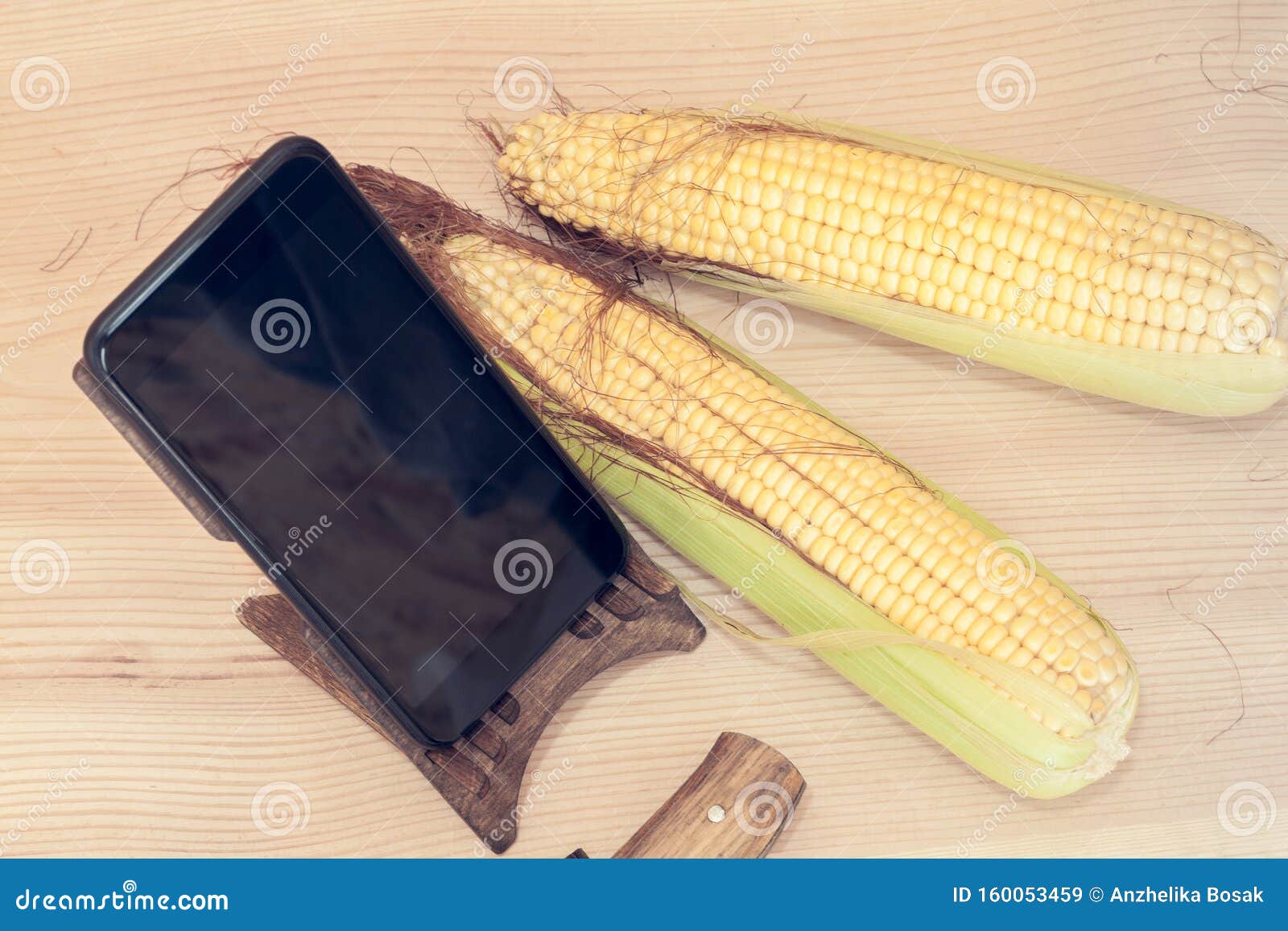 Mobile Phone on a Stand and Two Corn Stock Image - Image of design ...