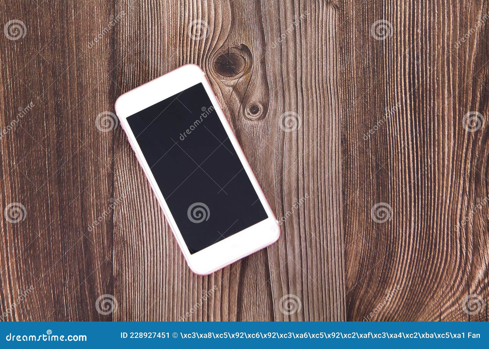 Mobile phone on the table stock image. Image of object - 228927451
