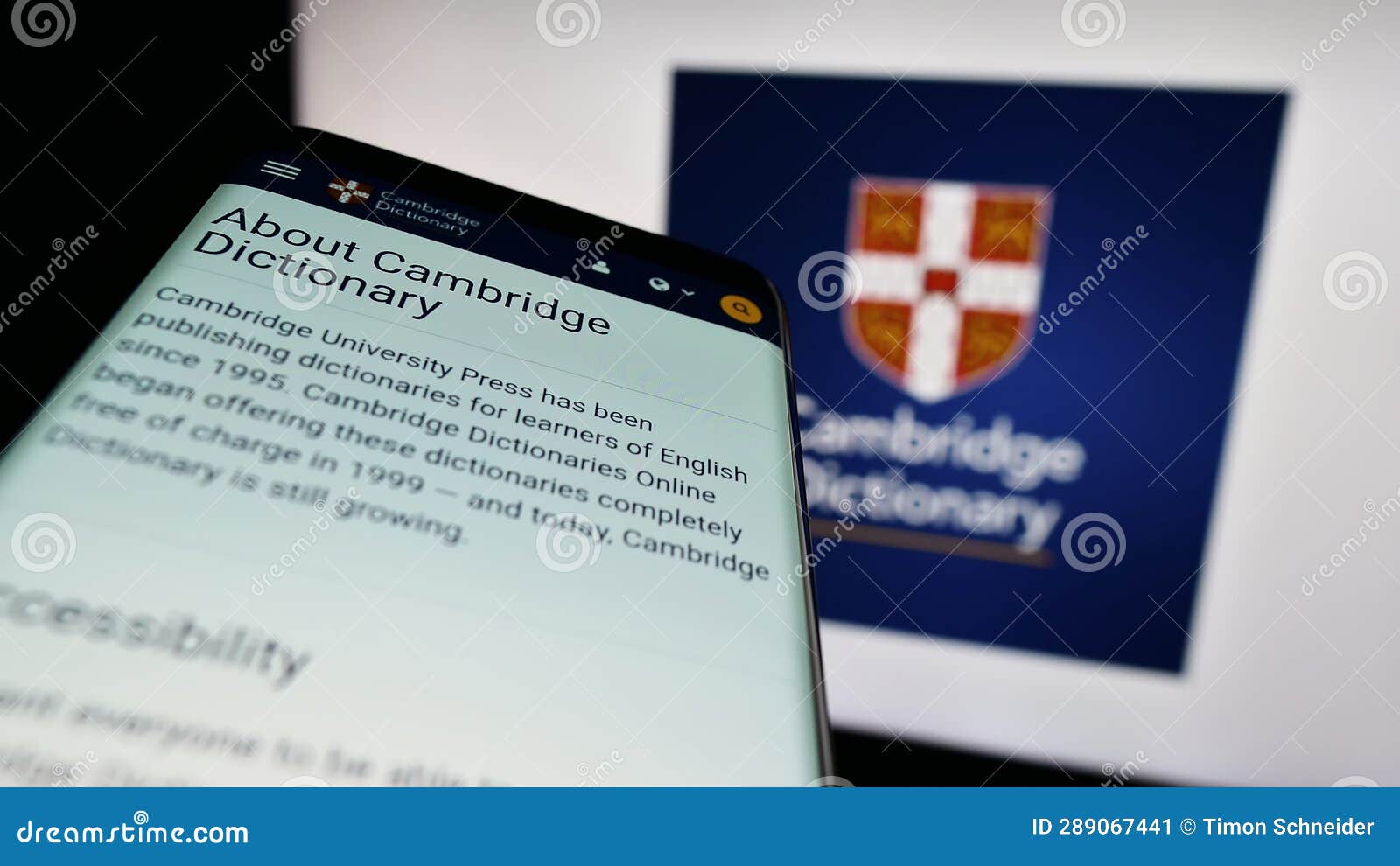 Mobile Phone with Webpage of Cambridge Dictionary on Screen in Front of ...