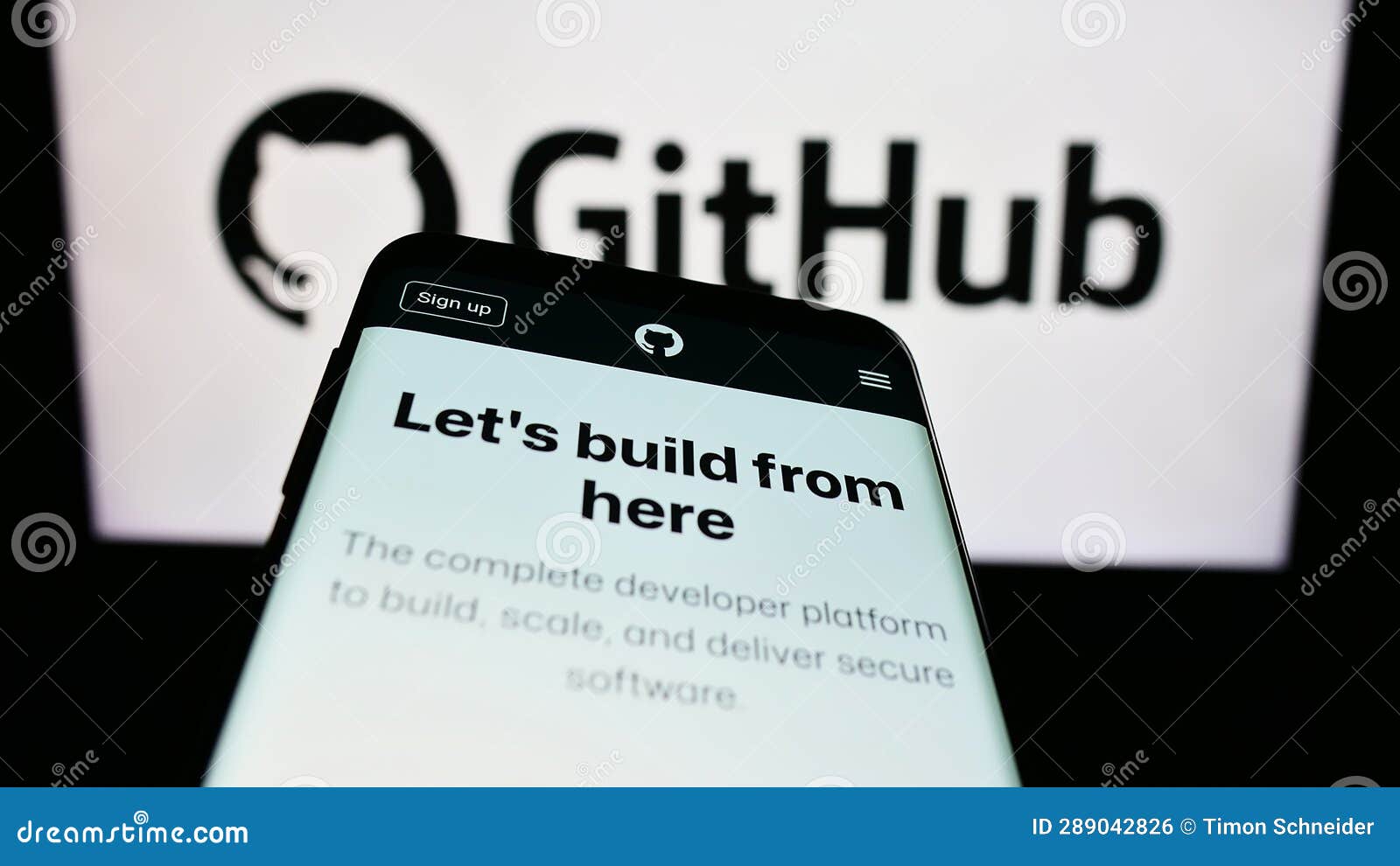 Mobile Phone with Webpage of US Software Development Company GitHub Inc. on Screen in Front of ...