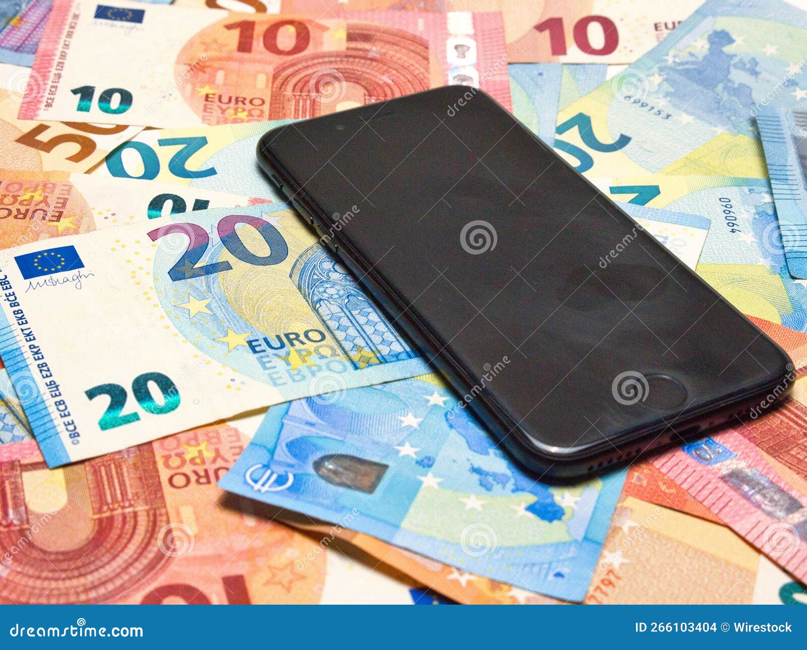 Mobile Phone Which is on Different Euro Bills with a Focus Level Stock ...