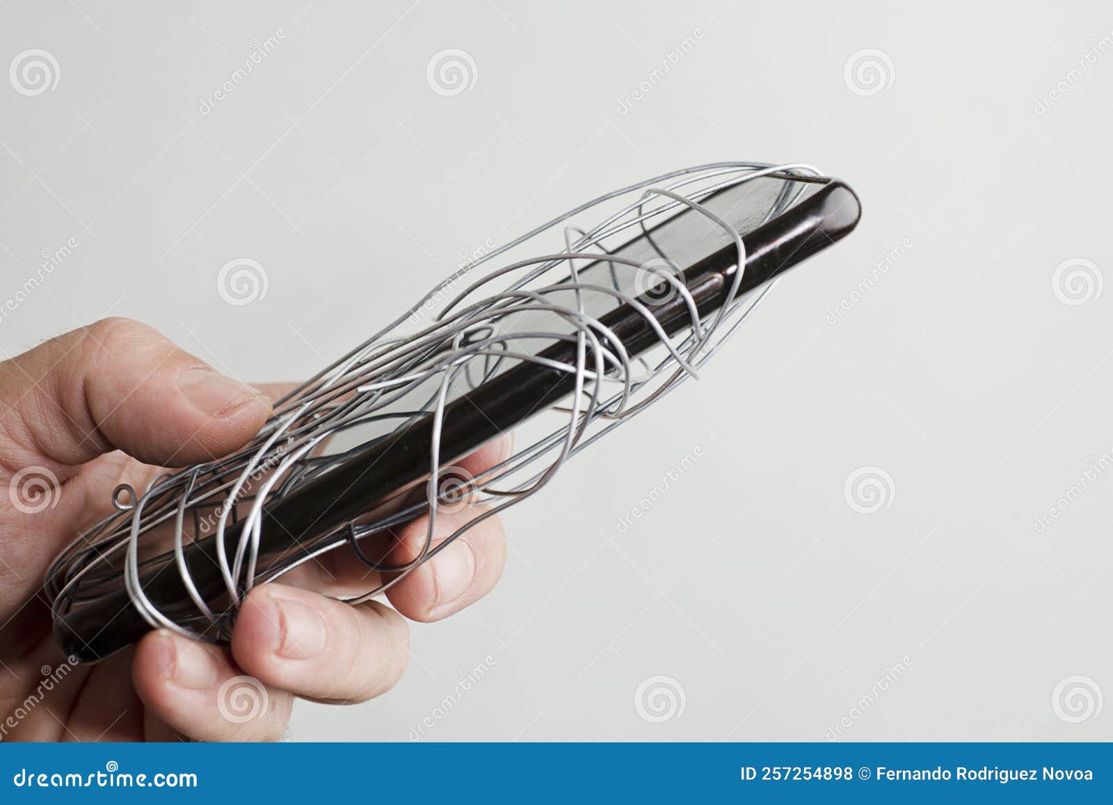 Mobile phone in wire stock photo. Image of mobile, faraday - 257254898