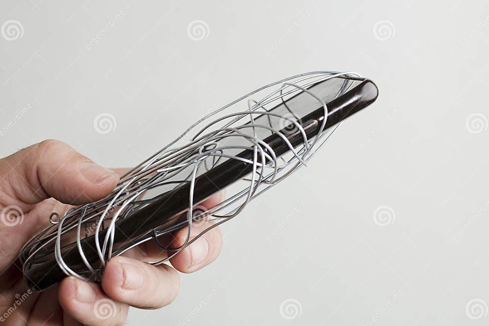 Mobile phone in wire stock photo. Image of mobile, faraday - 257254898