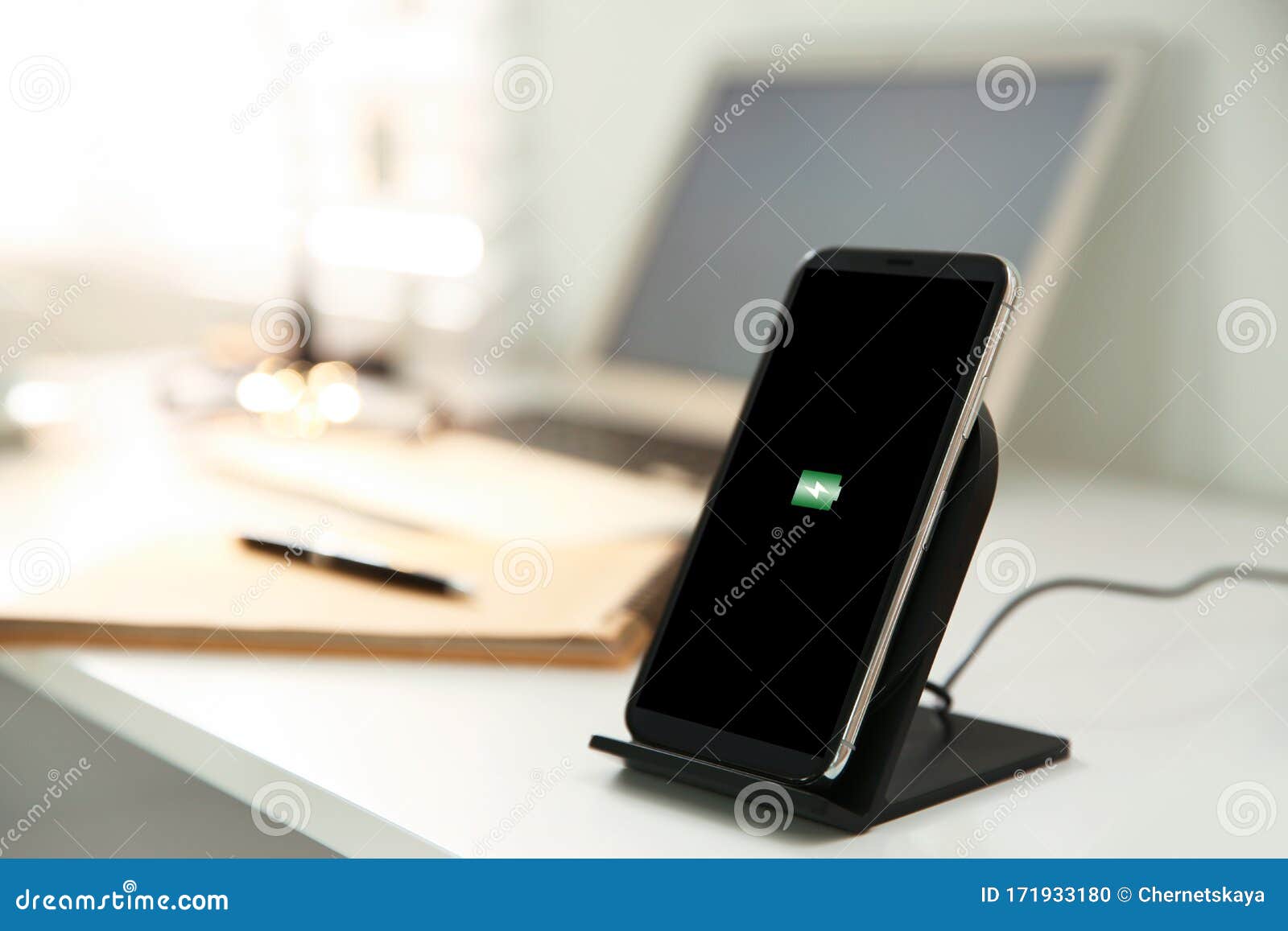 Mobile Phone with Wireless Charger on Table. Modern Workplace Accessory ...