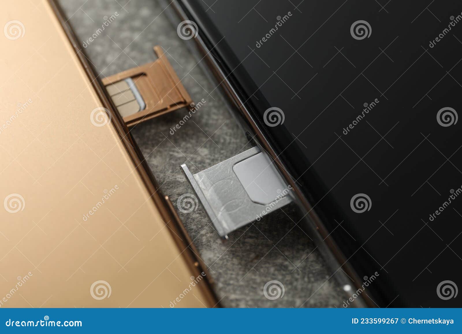 Mobile Phones with Sim Cards in Trays on Grey Table, Closeup Stock ...