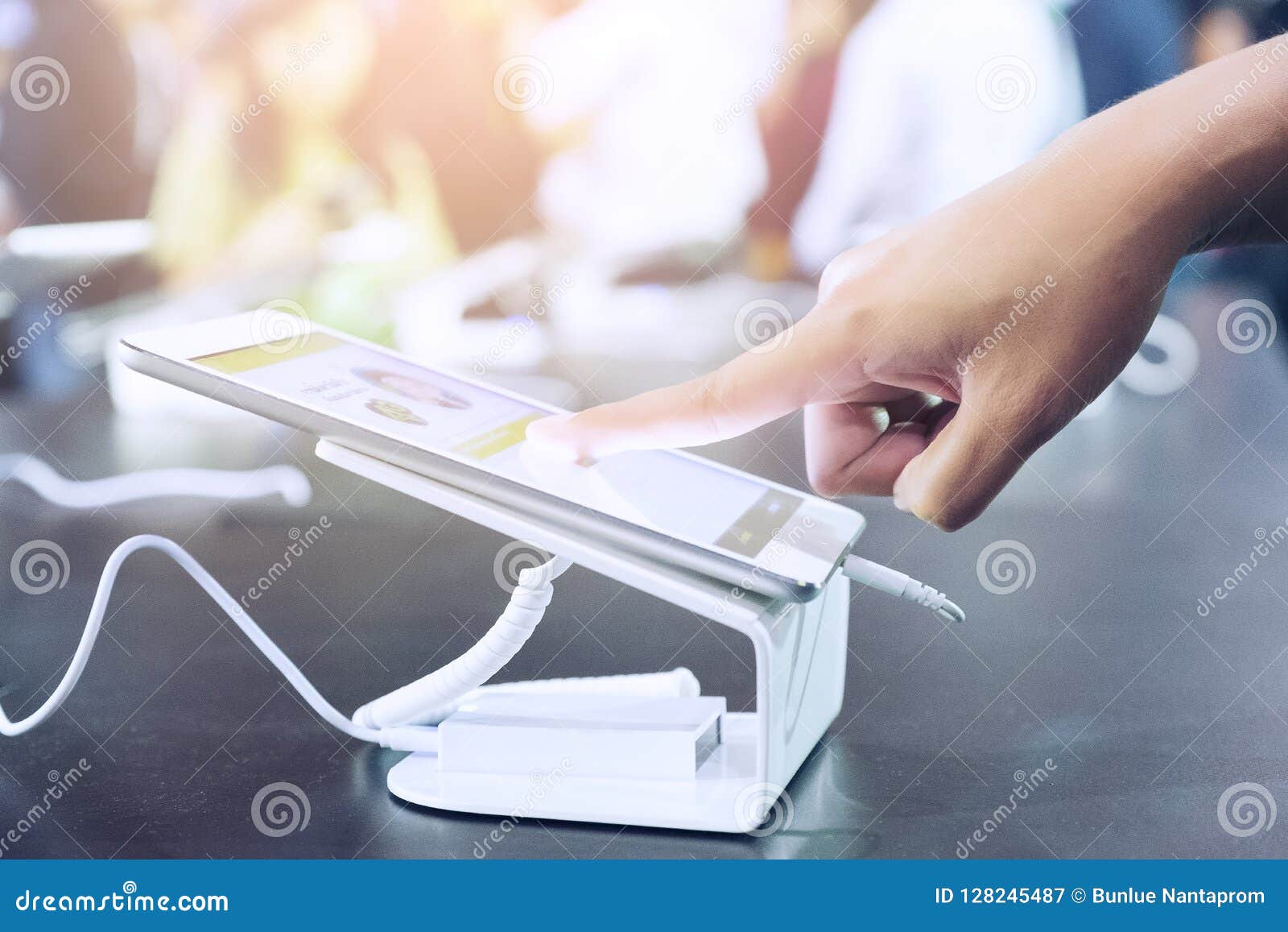 In Mobile Shop the Customer Takes on Screen Digital Tablet, Stan Stock ...
