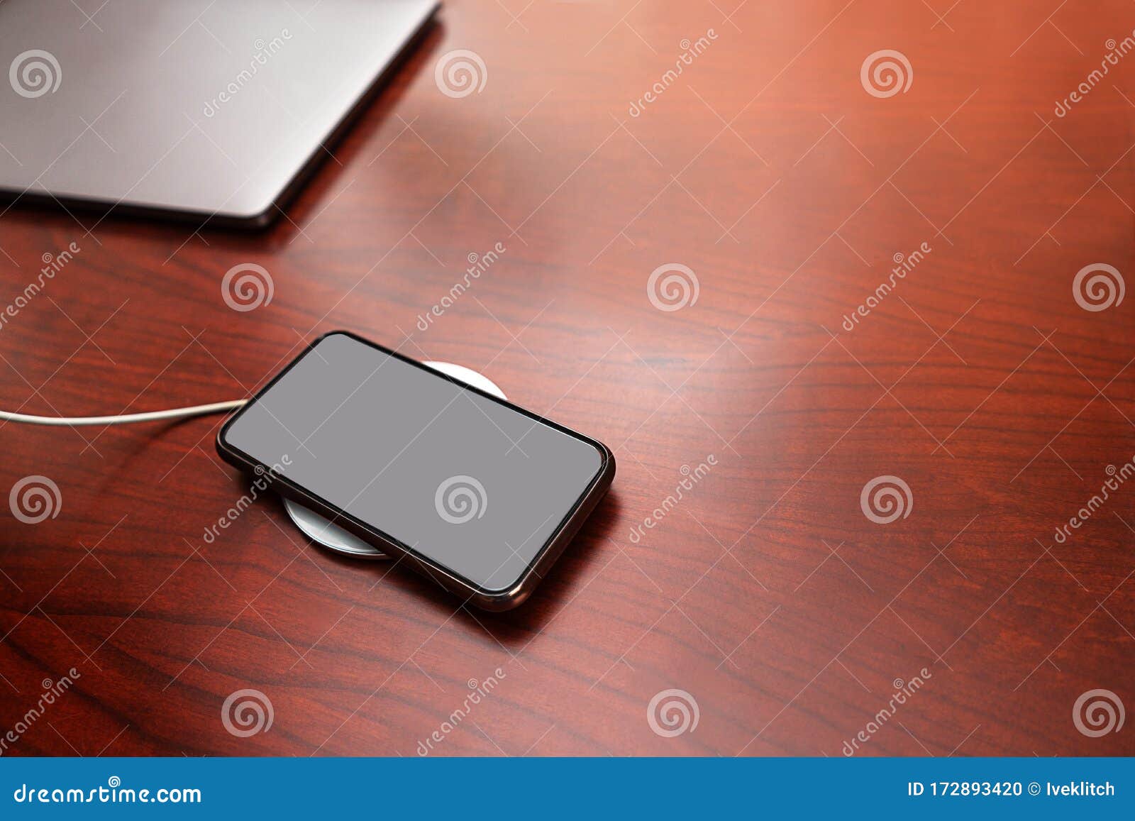 Wireless Charger with Modern Phone on Charge. Stock Photo - Image of ...