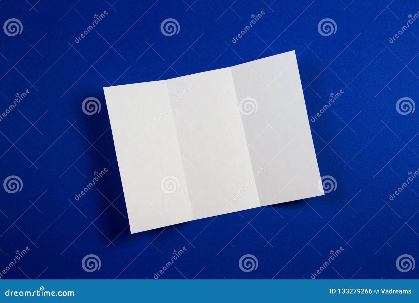 Mockup of Blank White Tri Fold Booklet Brochure on Blue Background ...