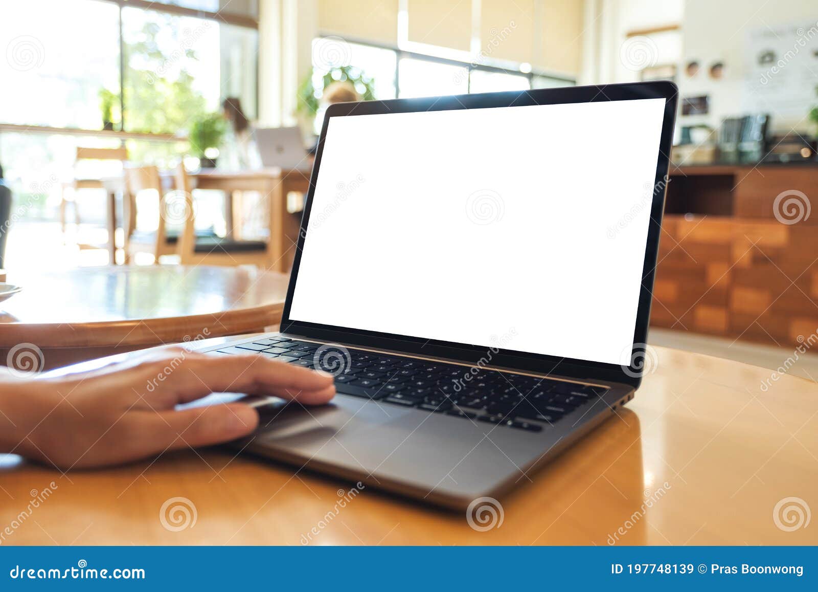 A Hand Touching on Laptop Computer Touchpad with Blank White Desktop ...