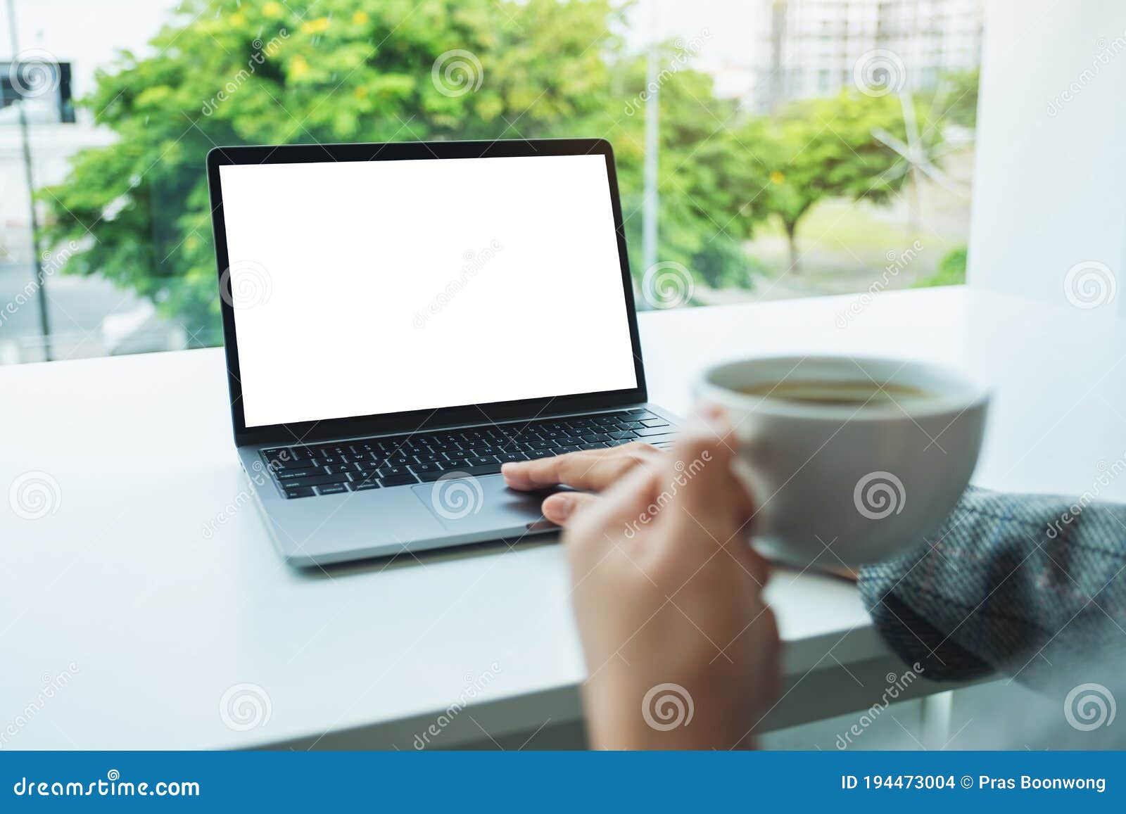 A Hand Using and Touching on Laptop Touchpad with Blank White Desktop ...