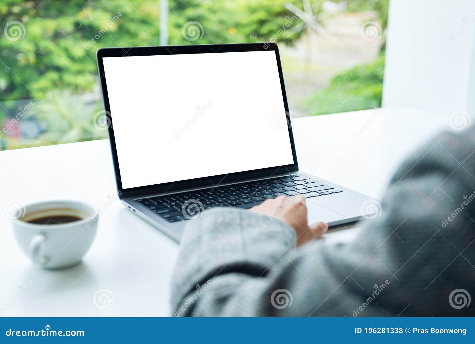 A Hand Using and Touching on Laptop Touchpad with Blank White Desktop ...