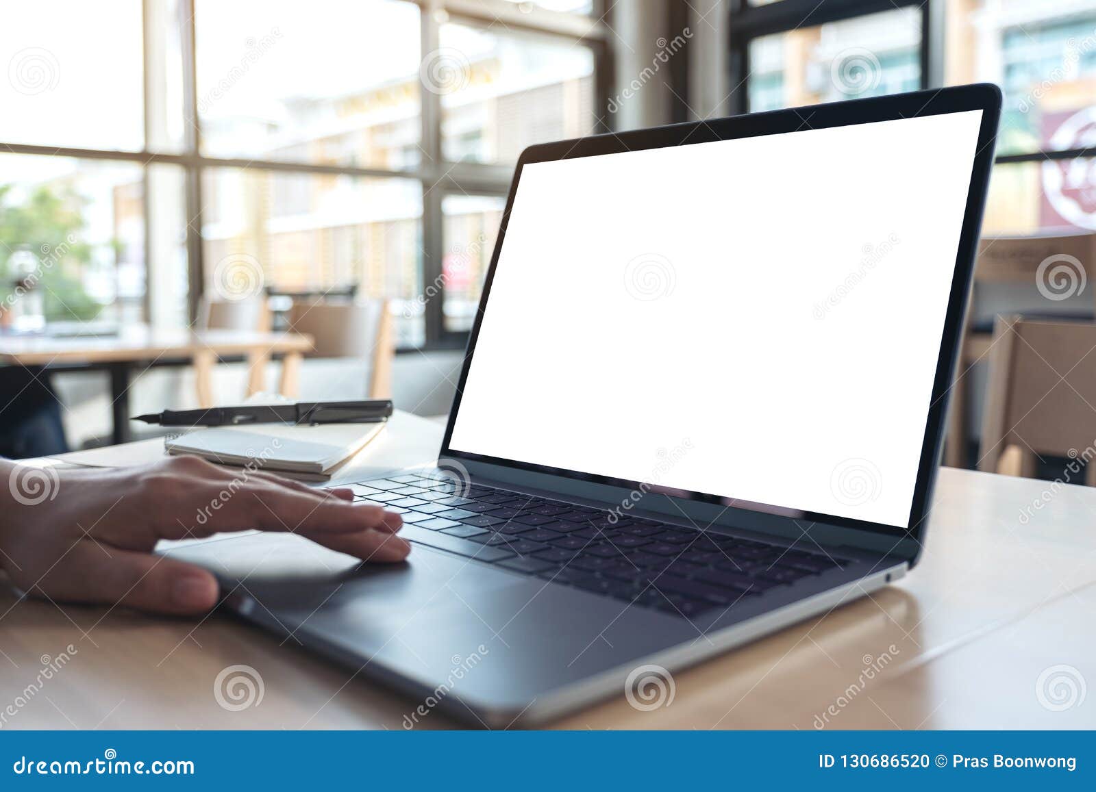 A Hand Using and Touching Laptop Touchpad with Blank White Desktop ...