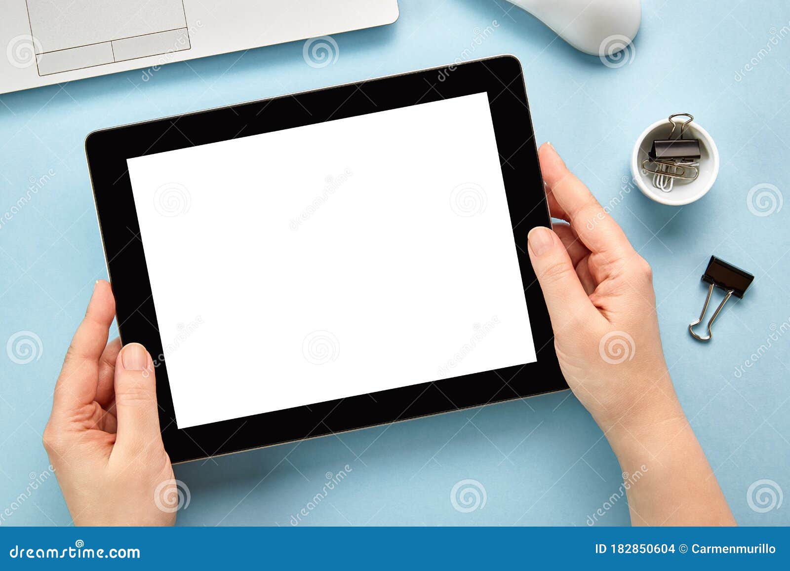 Mockup Image of Hands Using a Horizontal Tablet with Blank Screen on ...