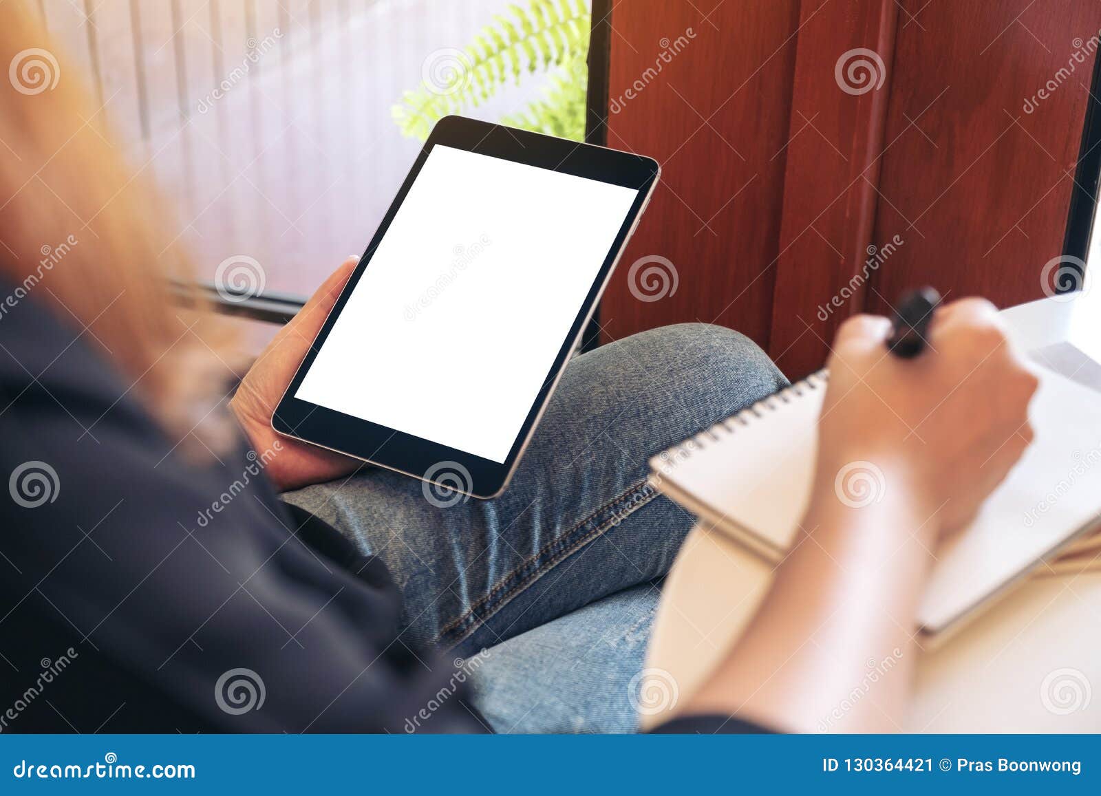 A Woman Holding and Using Black Tablet Pc with Blank White Desktop ...