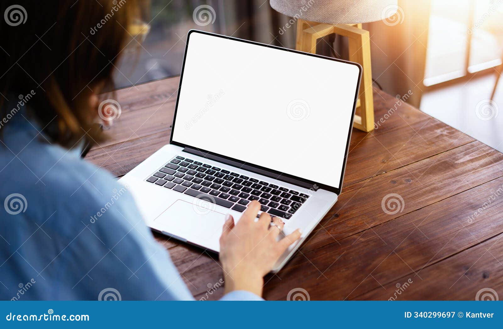 Mockup Image of a Woman Using Laptop with Blank Screen on Wooden Table ...