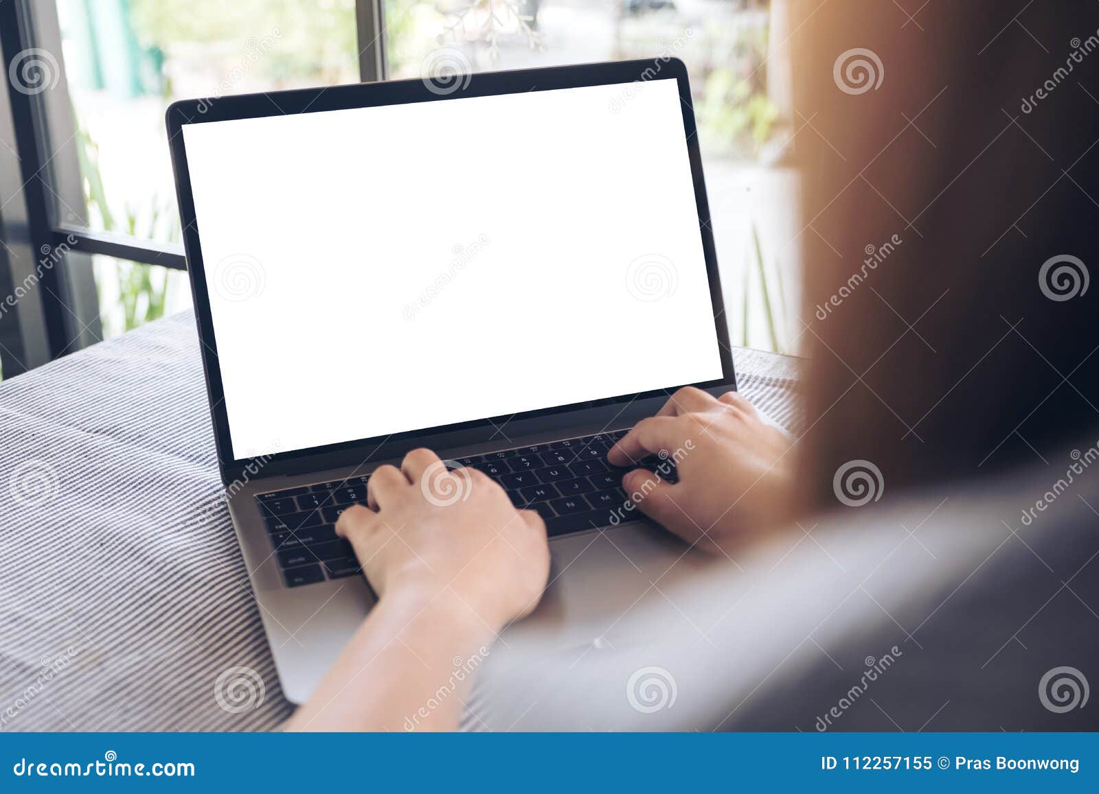 A Woman Using and Touching Laptop with Blank White Desktop Screen on ...