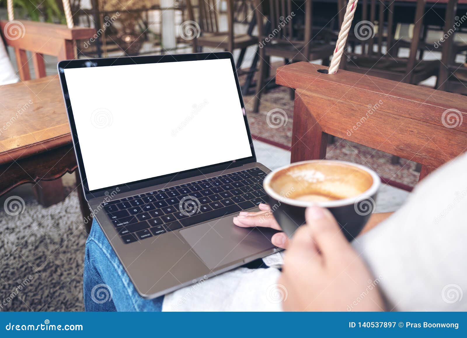A Woman Using and Typing on Laptop with Blank White Screen while ...