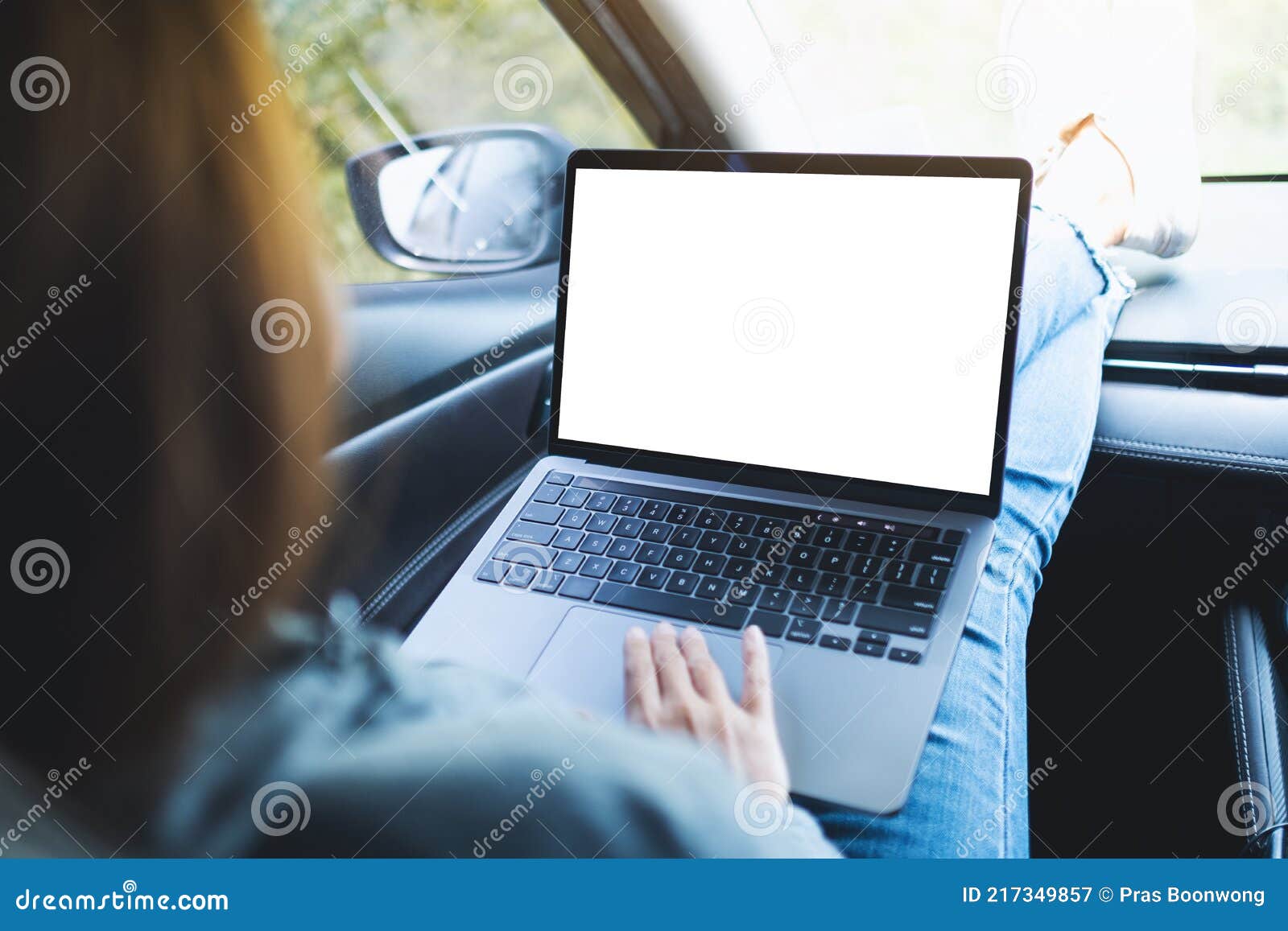 A Woman Using and Working on Laptop Computer with Blank Desktop Screen ...