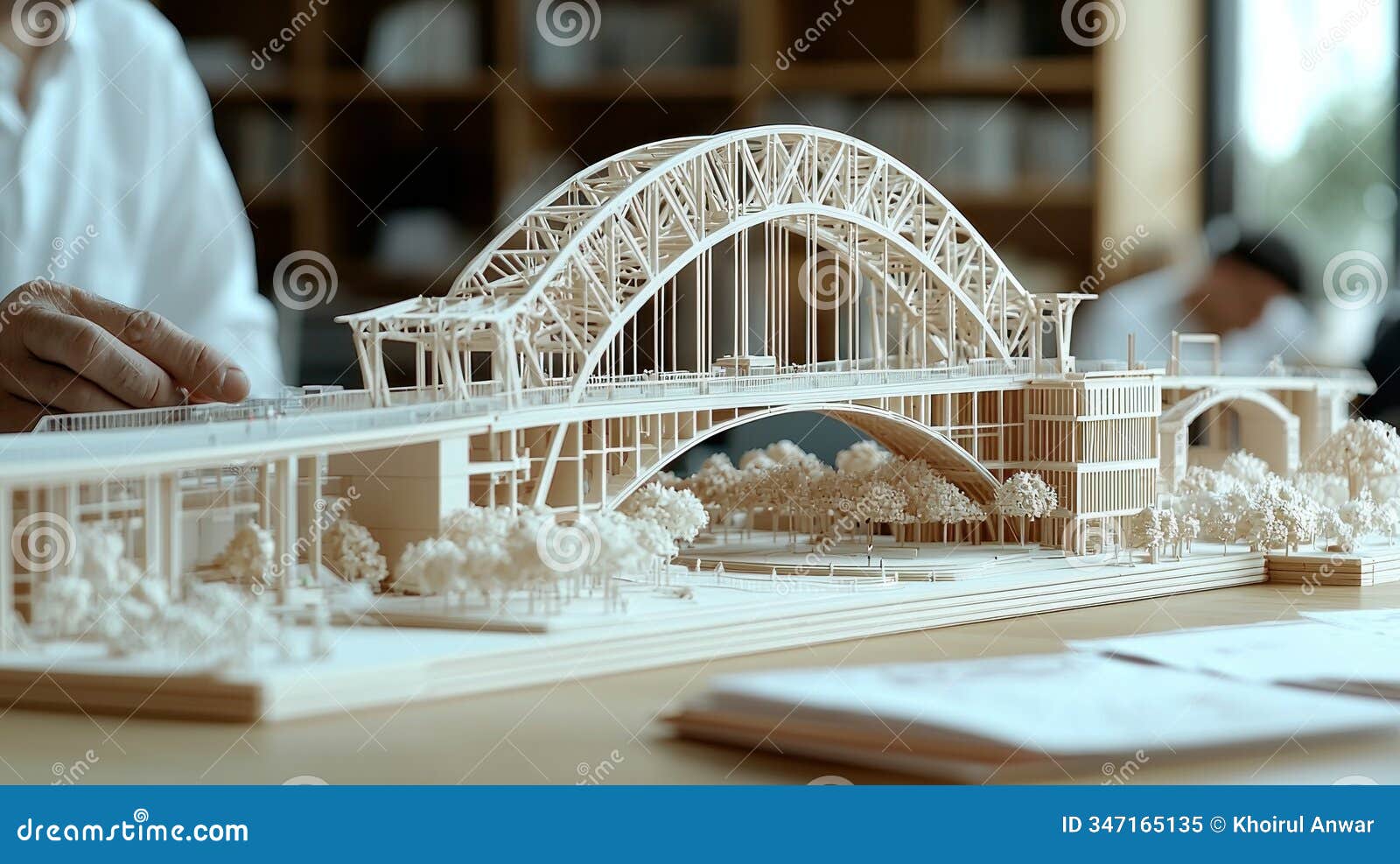 A Model of a Bridge in a Design Studio with an Architect Looking at it ...