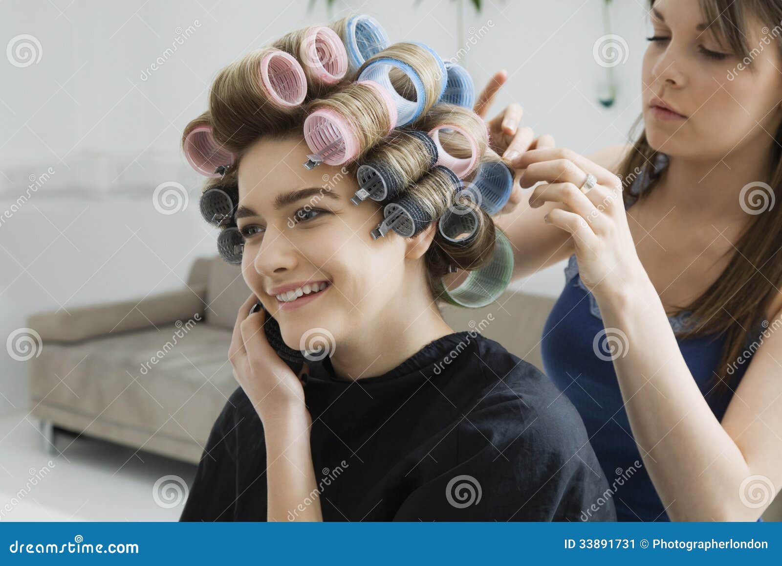 Model on Call while Having Hair Curled Stock Image - Image of ...