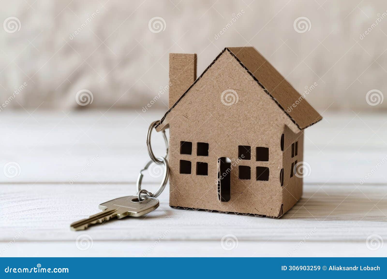 A Model of a Cardboard House on a Table with a Key Stock Image - Image ...