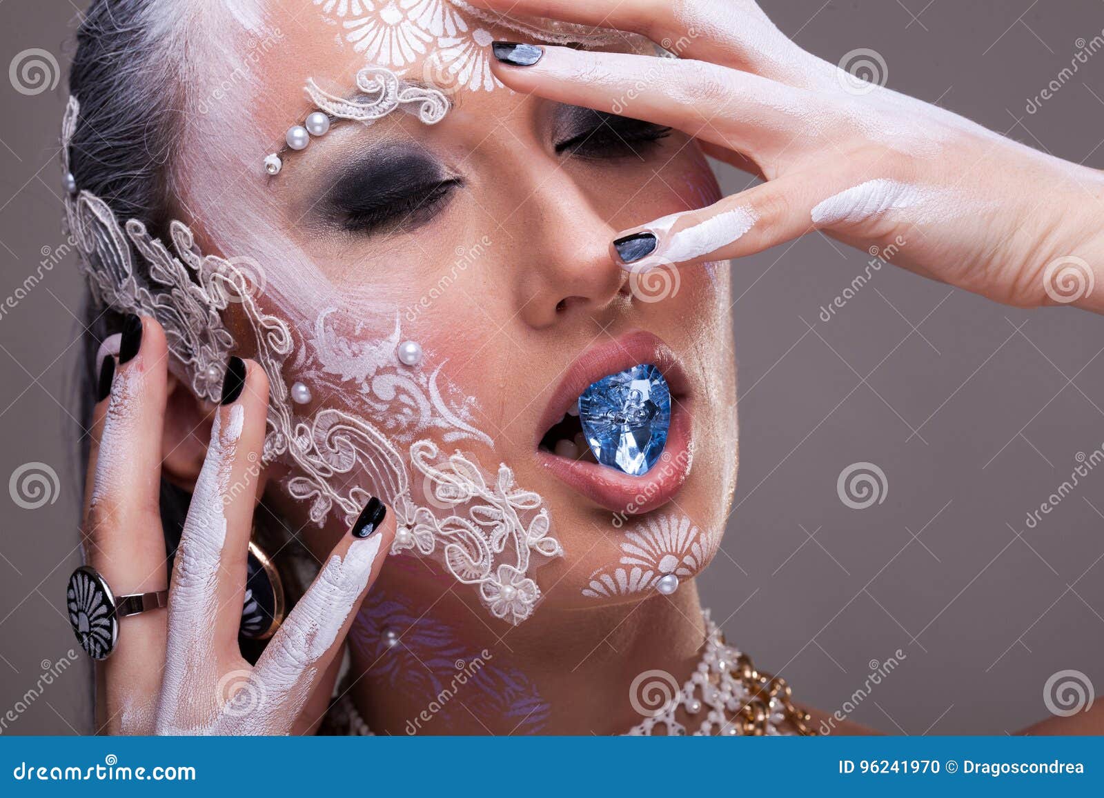Model with Creative Make Up Holding a Gem in Mouth Stock Photo - Image ...