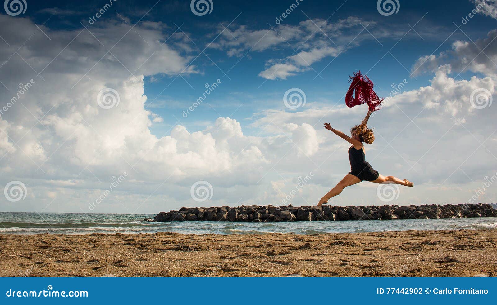 Model dancing on the beach stock photo. Image of dance - 77442902