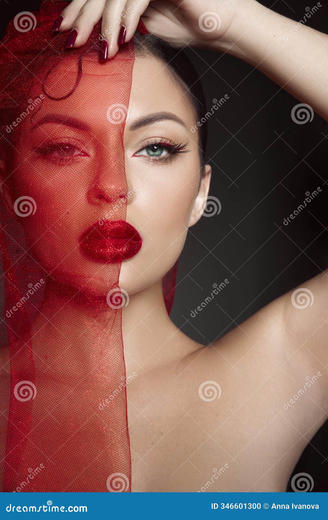 Model Demonstrates an Artistic Makeup Look by Draping Sheer Red Fabric ...
