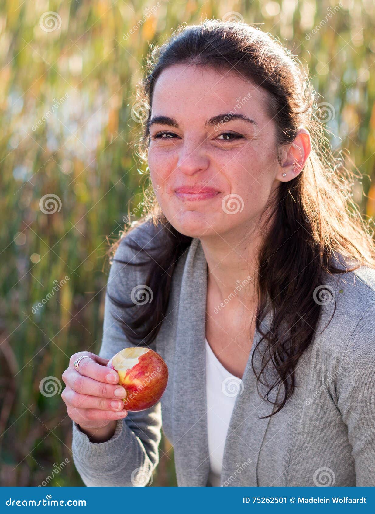 Model eating an apple stock image. Image of young, teen - 75262501