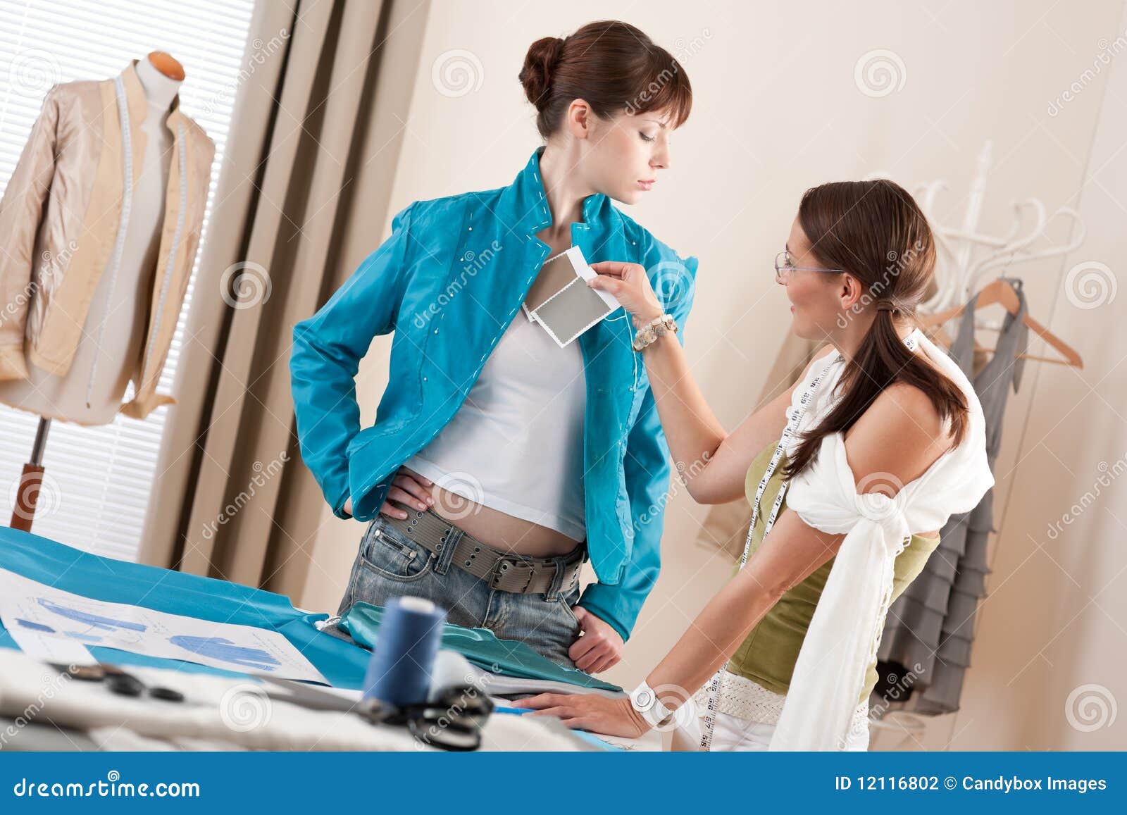 Model Fitting by Female Fashion Designer Stock Photo - Image of ...