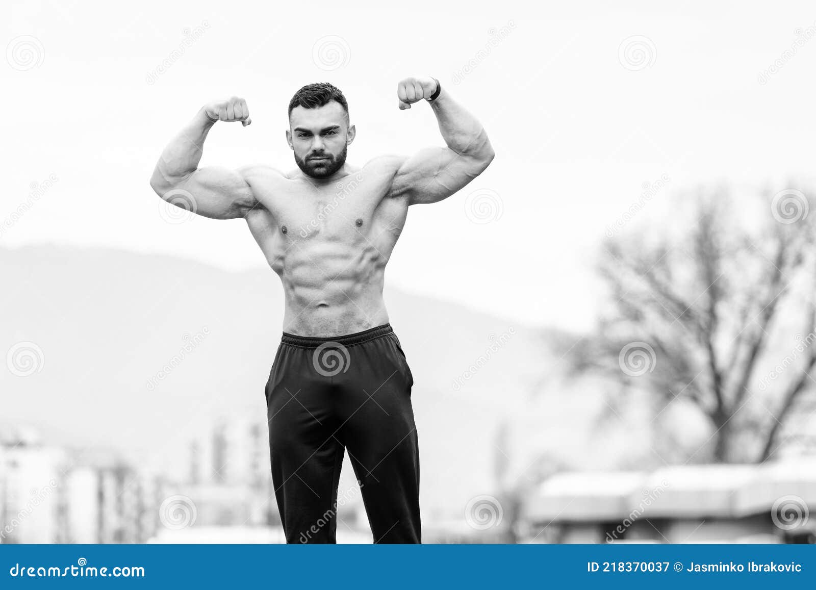 Model Flexing Muscles Outdoors Stock Image - Image of body, bodybuilder ...