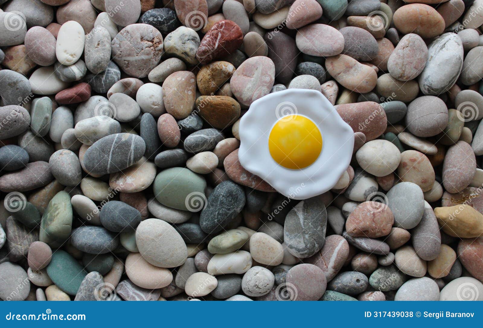 Model of Single Fried Egg on Colored Pebbles Stock Photo - Image of ...